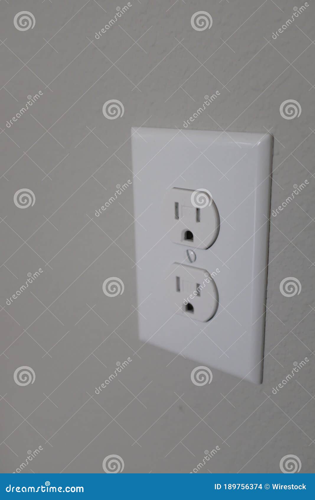 Vertical Shot of an Electric Plug -- Side View on the Wall Stock Photo ...
