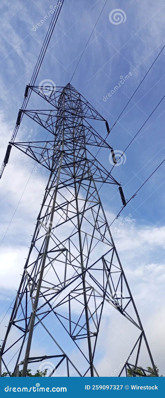 Vertical Shot of an Electric Tower High Voltage Post with Blue Sky ...