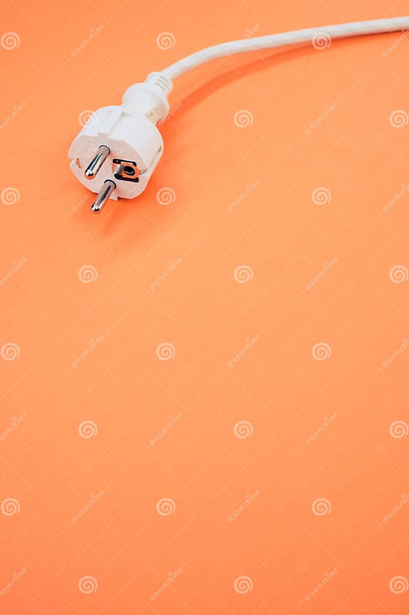 Vertical Shot of an Electrical Wire and Plug on an Orange Surface Stock ...