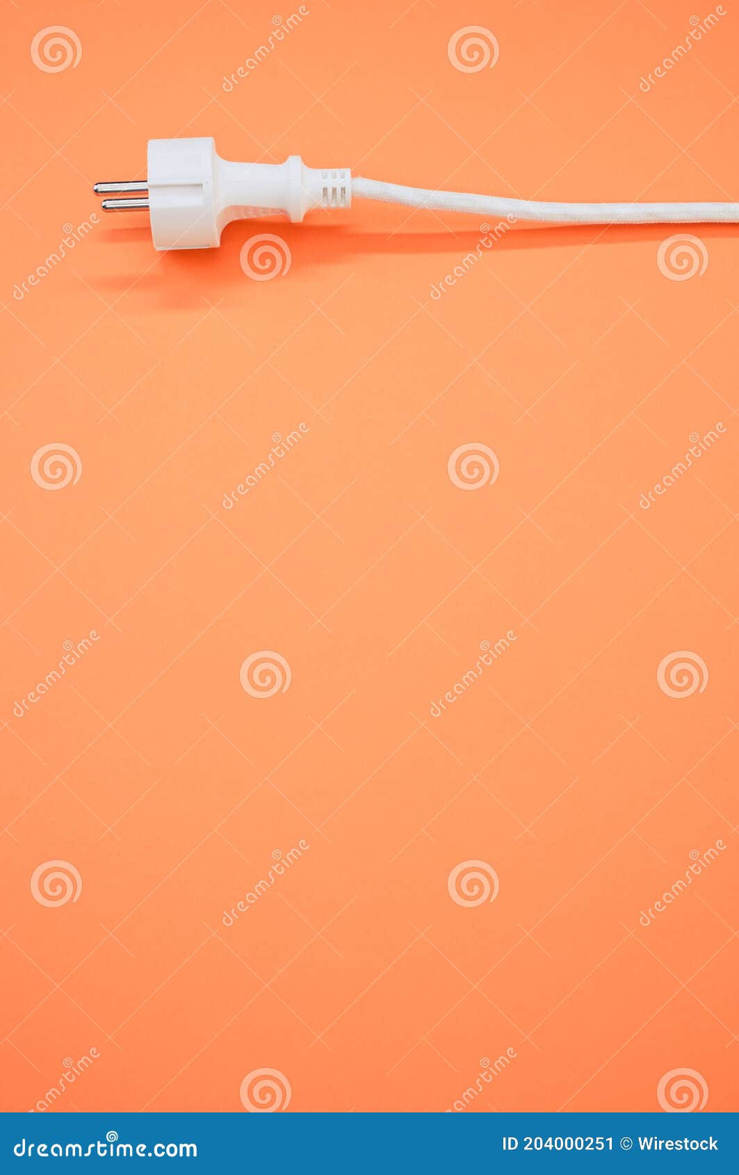 Vertical Shot of an Electrical Wire and Plug on an Orange Surface Stock ...