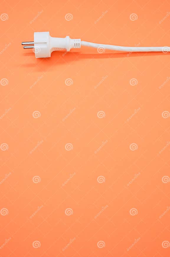 Vertical Shot of an Electrical Wire and Plug on an Orange Surface Stock ...