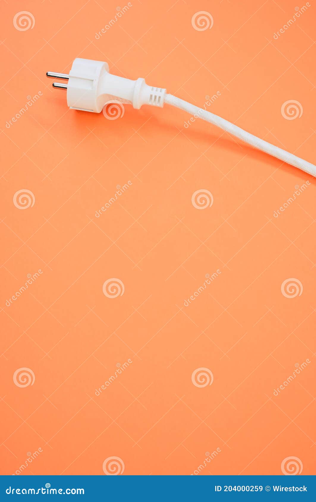 Vertical Shot of an Electrical Wire and Plug on an Orange Surface Stock ...