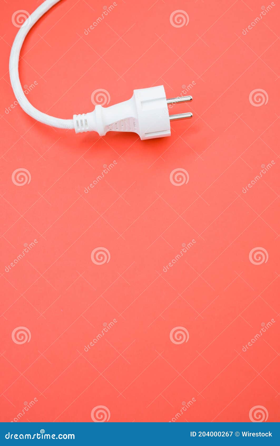Vertical Shot of an Electrical Wire and Plug on a Pink Surface Stock ...