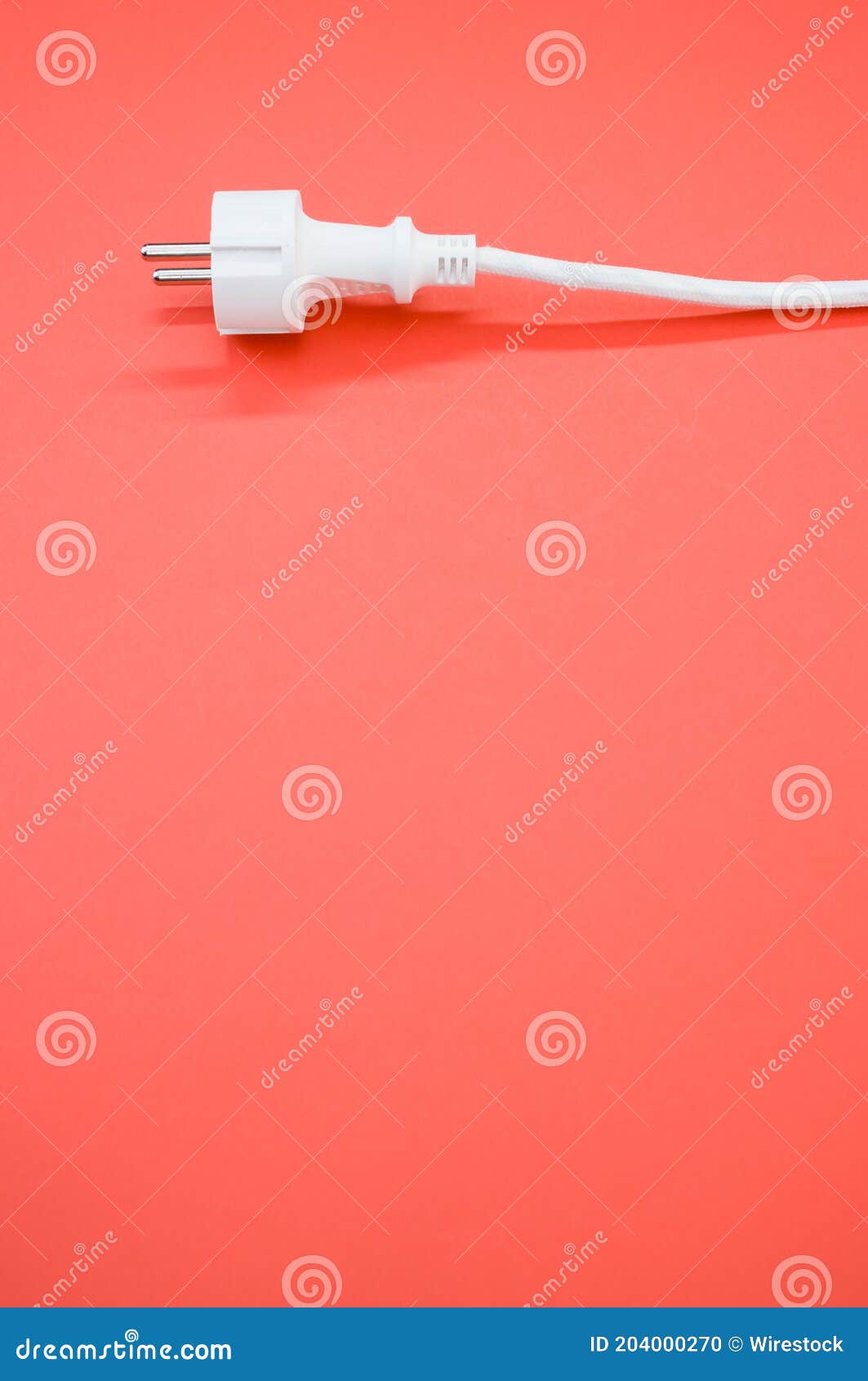 Vertical Shot of an Electrical Wire and Plug on a Pink Surface Stock ...
