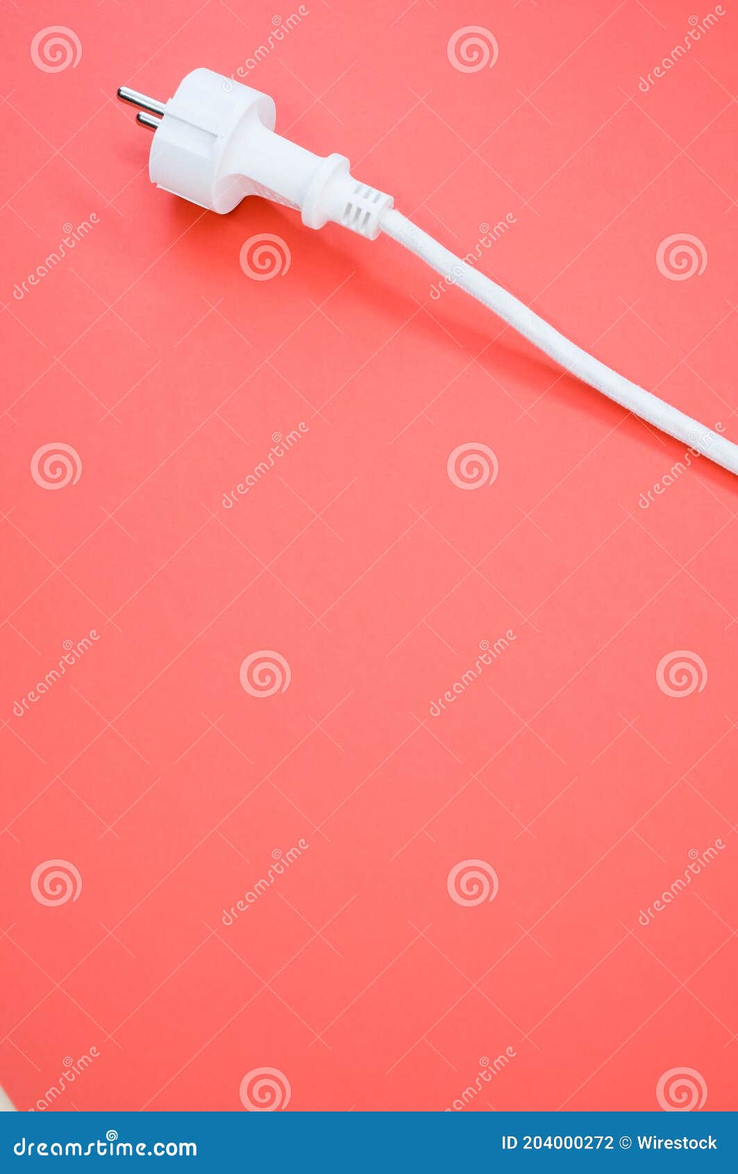 Vertical Shot of an Electrical Wire and Plug on a Pink Surface Stock ...