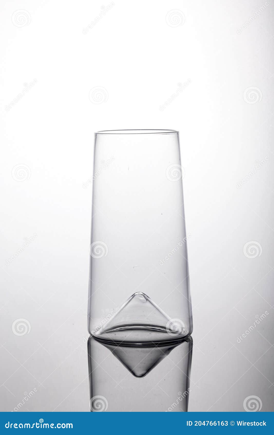 Vertical Shot of an Empty Highball Glass with a Concave Bottom on the ...