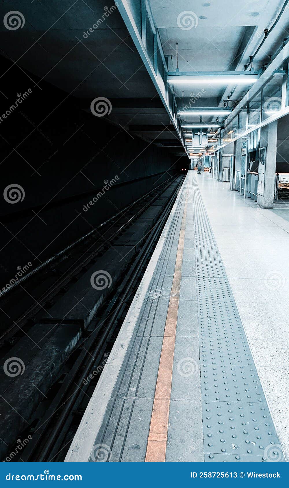 Vertical Shot of a Empty Modern Subway Station Platform with Direction ...