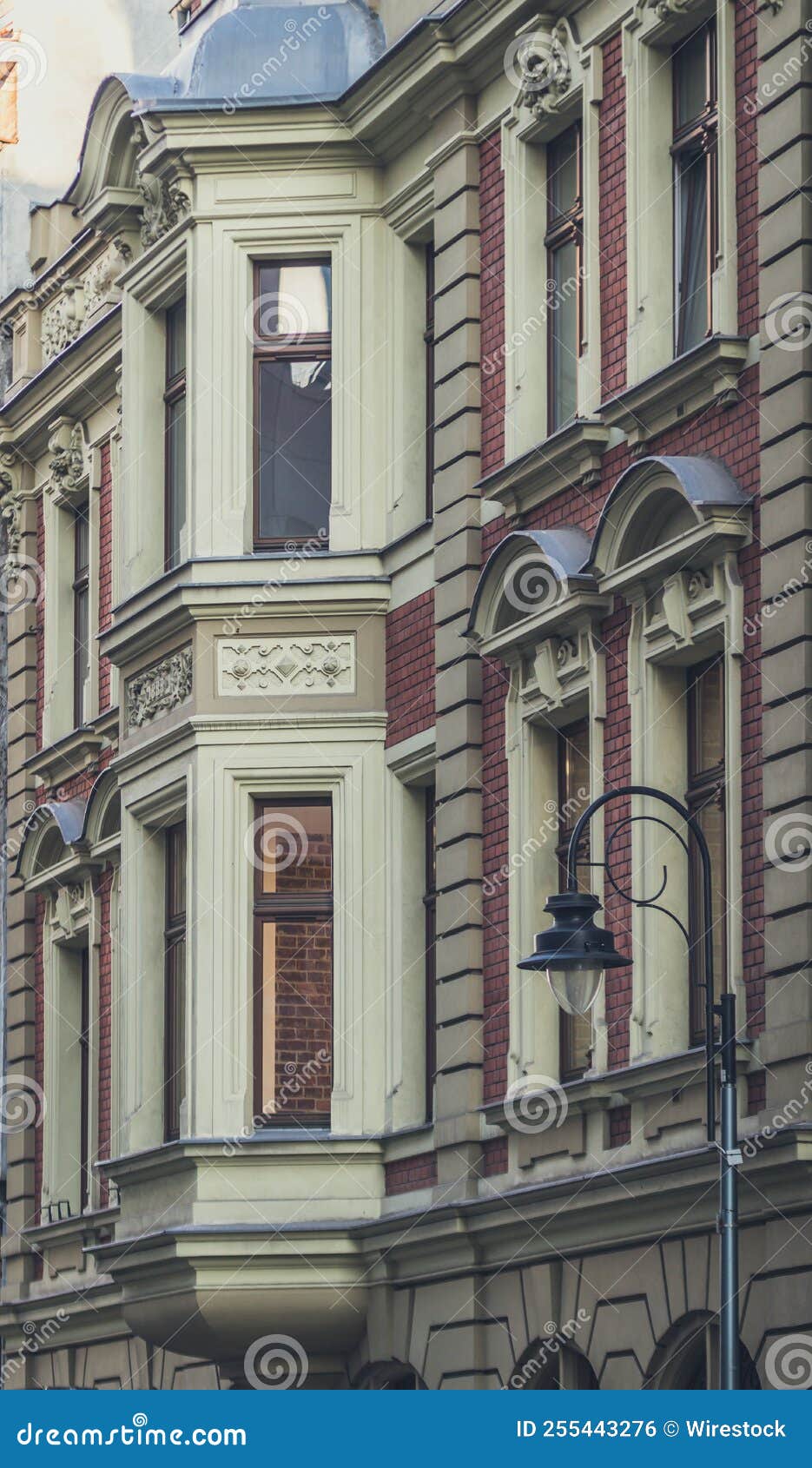 Vertical Shot of the Facade and Windows of a Building on the Side of a ...