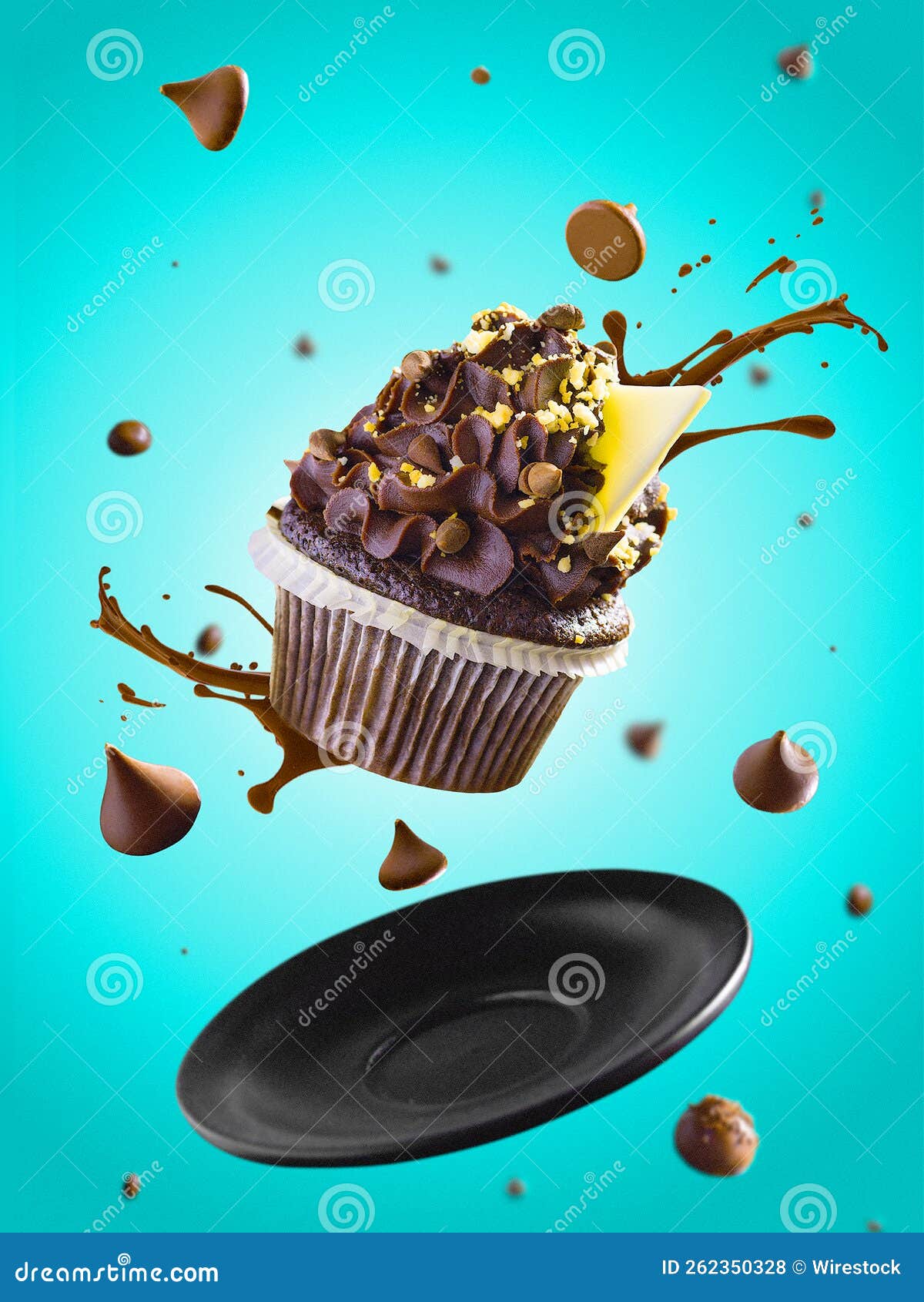 Vertical Shot of a Falling Chocolate Cupcake on Blue Background Stock ...