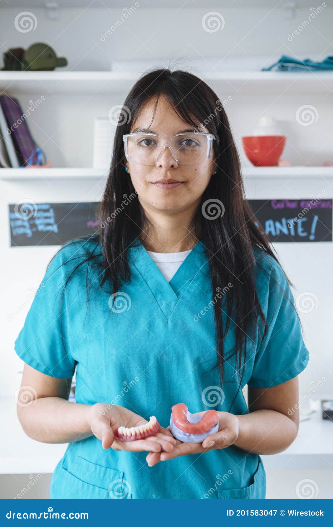 Vertical Shot of a Female Nurse Holding Dentures Stock Image - Image of ...