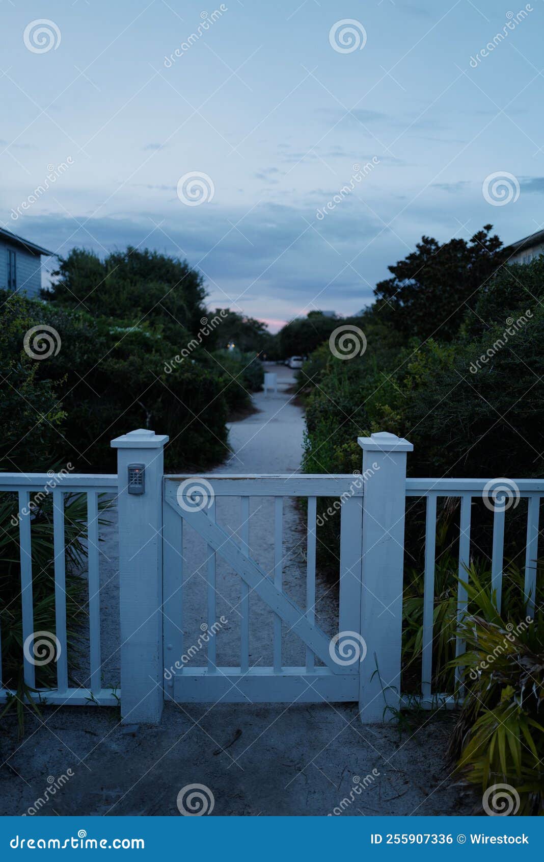 Vertical Shot of a Fence Leading To a River Stock Photo - Image of ...