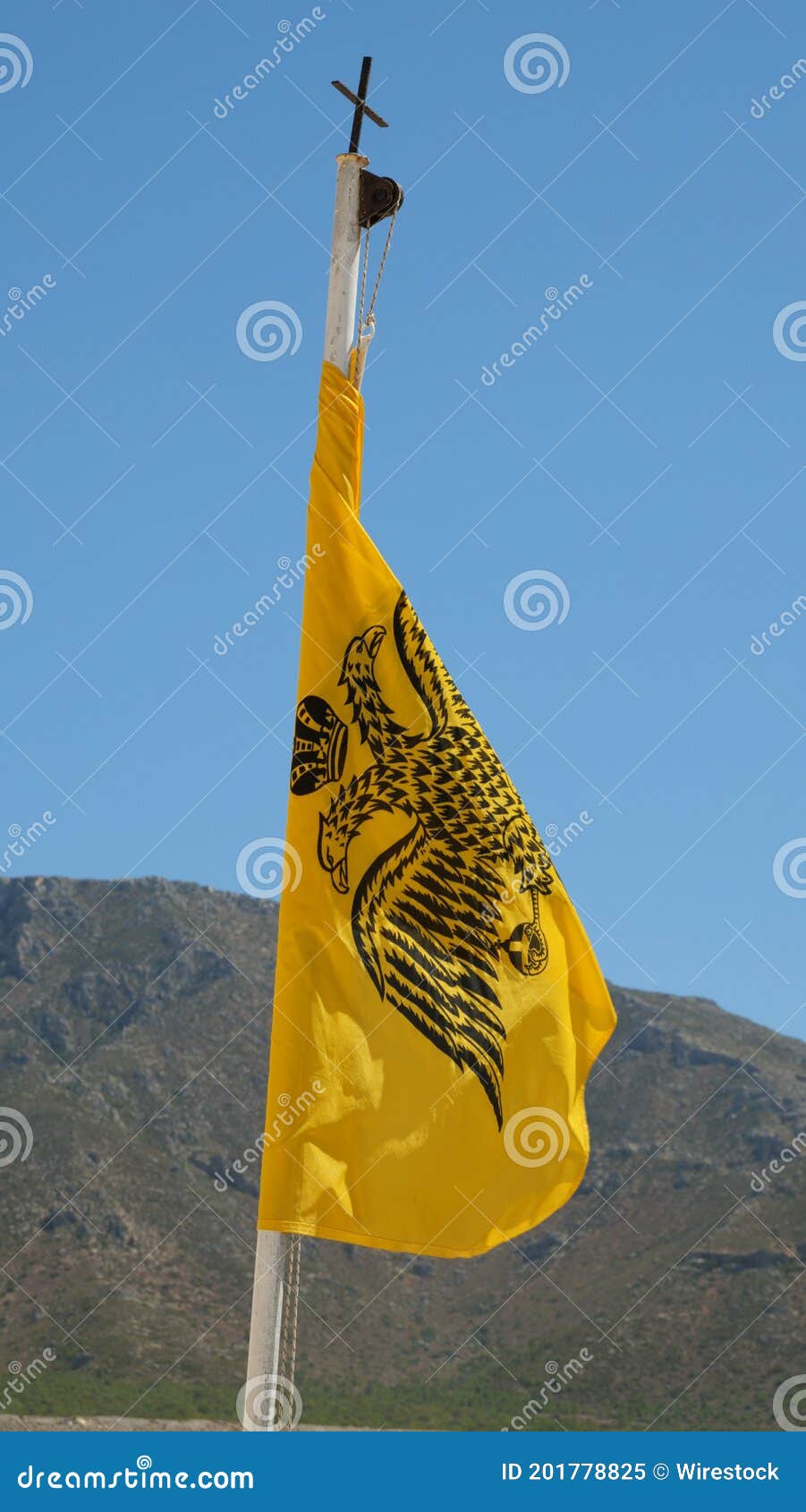 Vertical Shot of the Flag of Mount Athos Captured during the Daytime in ...