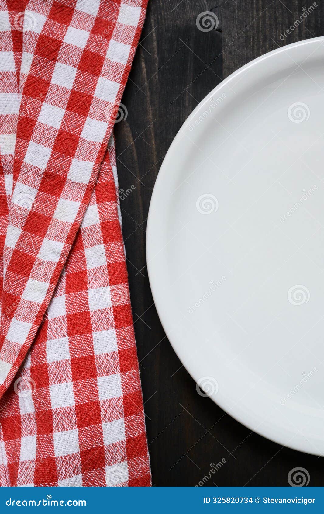 Vertical Shot of Flat White Dinner Plate on Kitchen Table Stock Photo ...