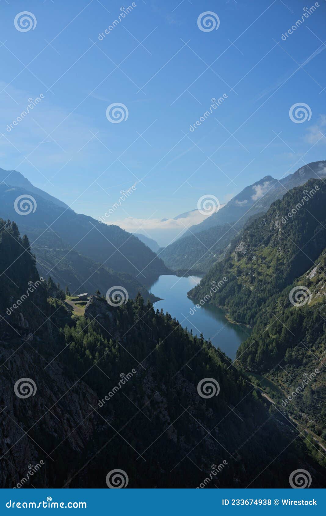 Vertical Shot of a Flowing River through Cliffs and Mountains Stock ...