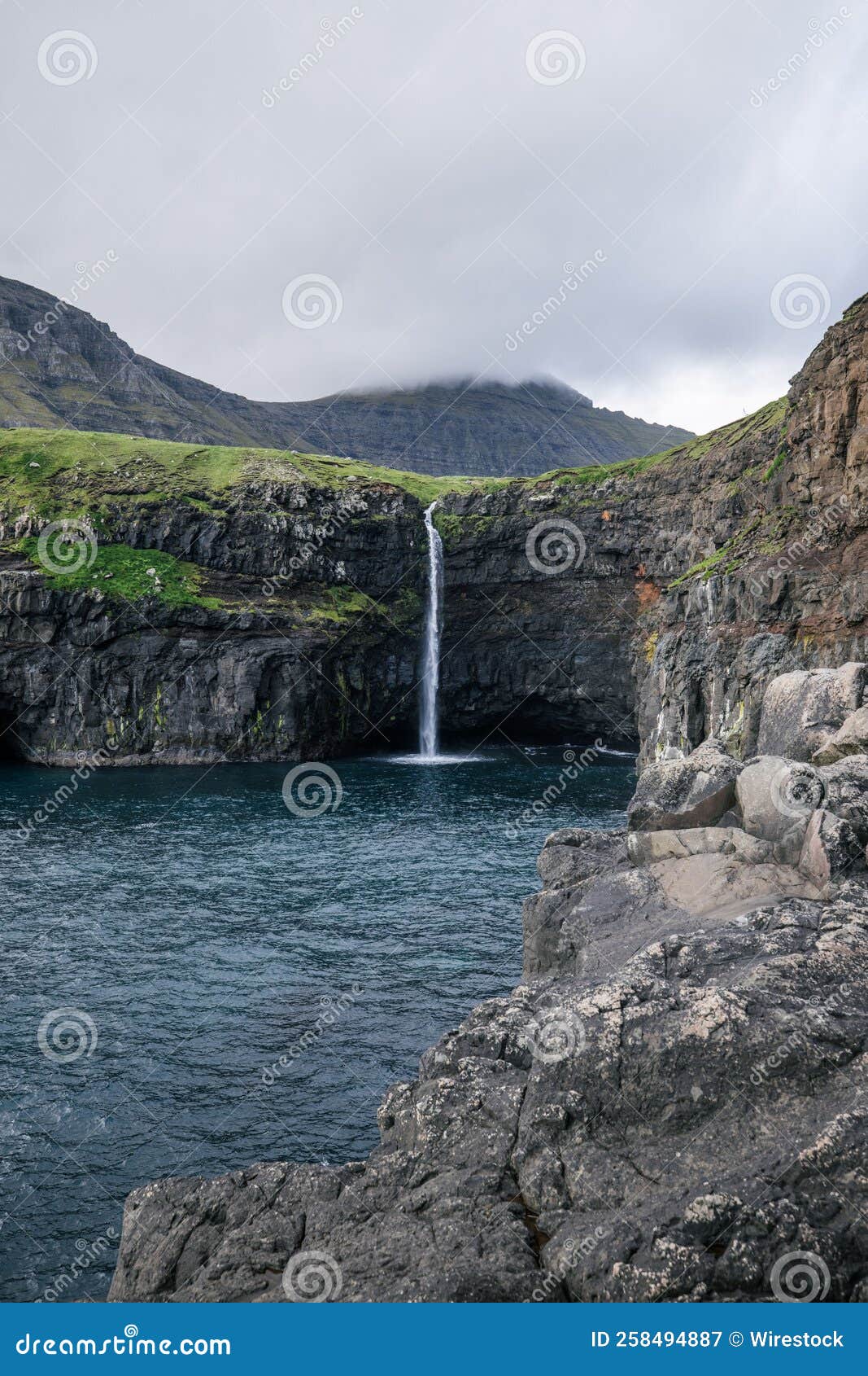 Vertical Shot of the Fossa Waterfall in the Faroe Islands Stock Image ...