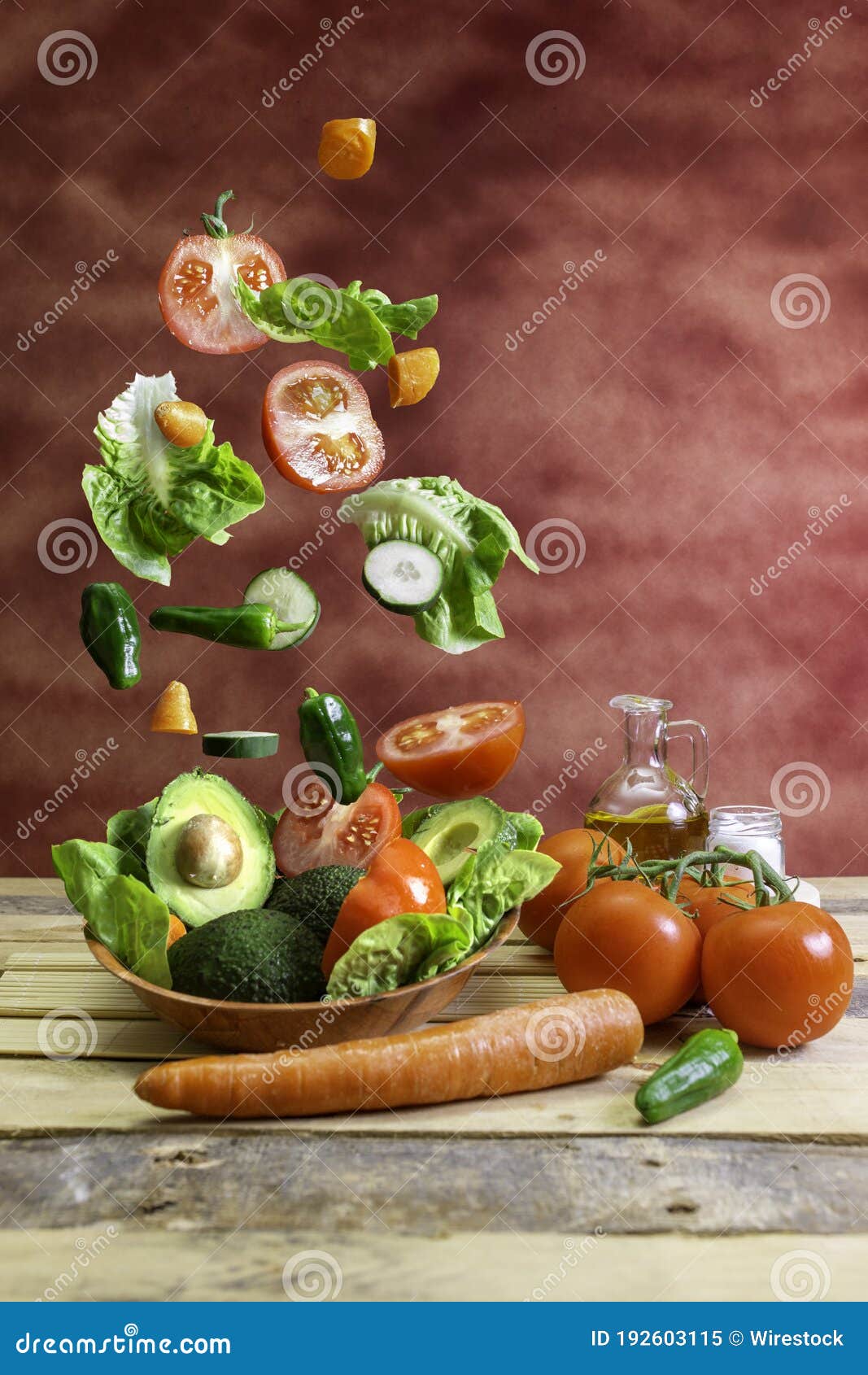 Vertical Shot of Fresh Vegetables Dropping into the Salad Stock Image ...