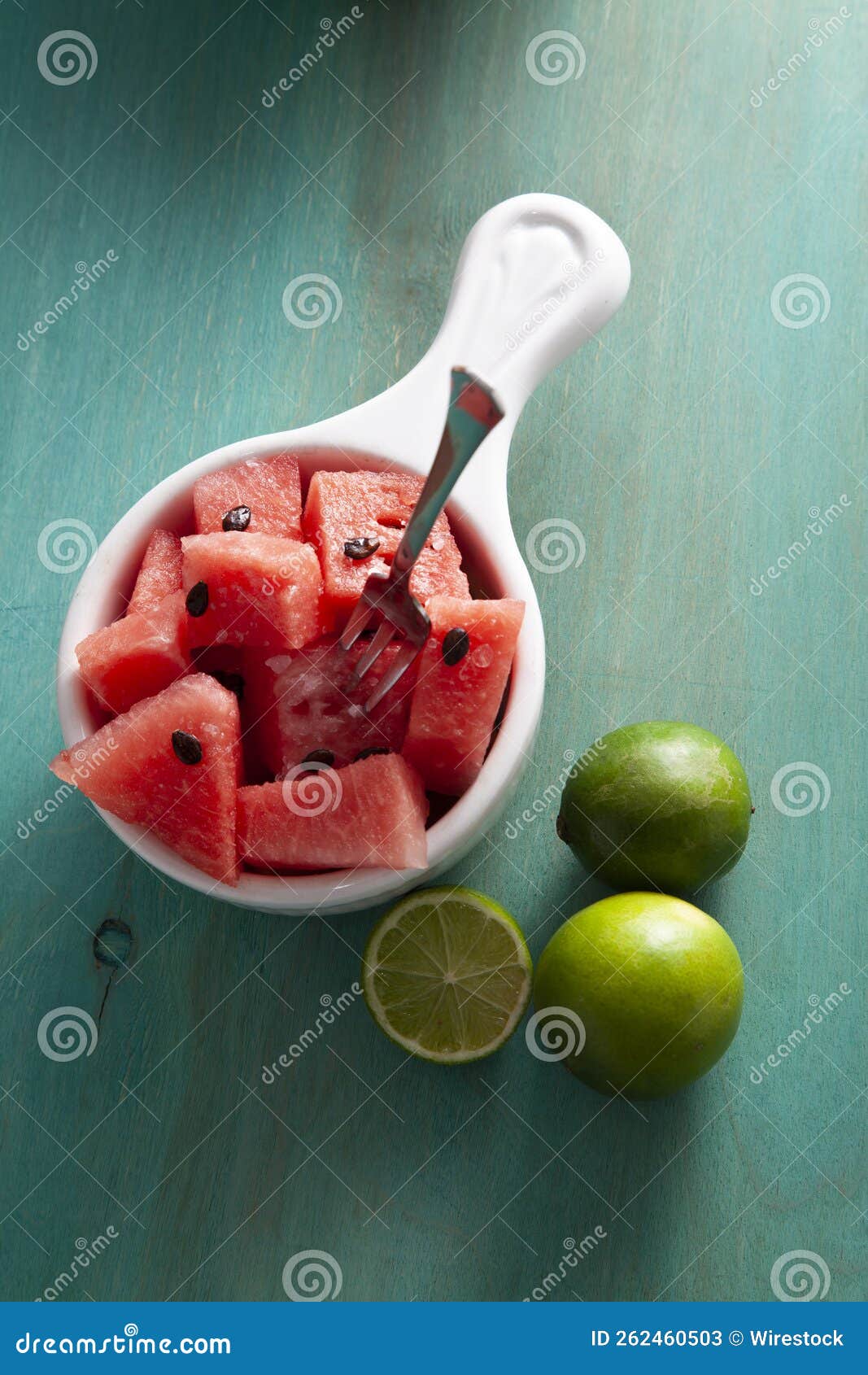 Vertical Shot of Fresh Watermelon Chunks in a White Measuring Cup with ...