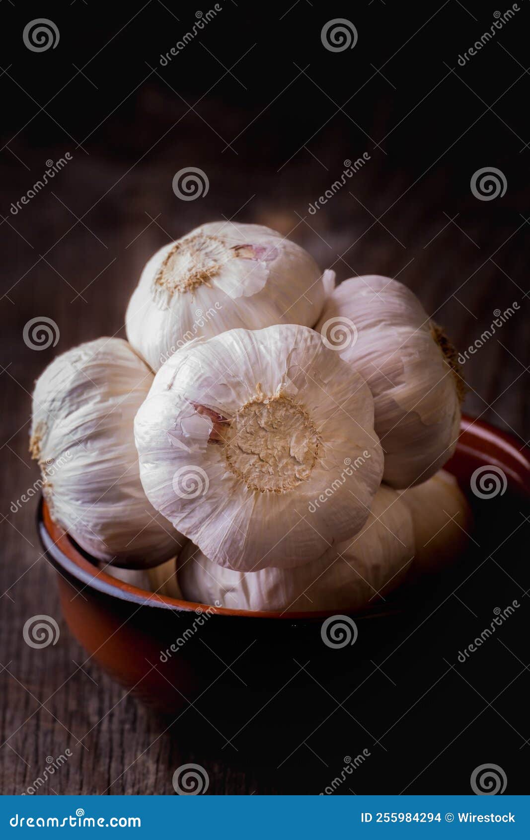 Vertical Shot of Garlics in a Clay Pot Stock Photo - Image of group ...