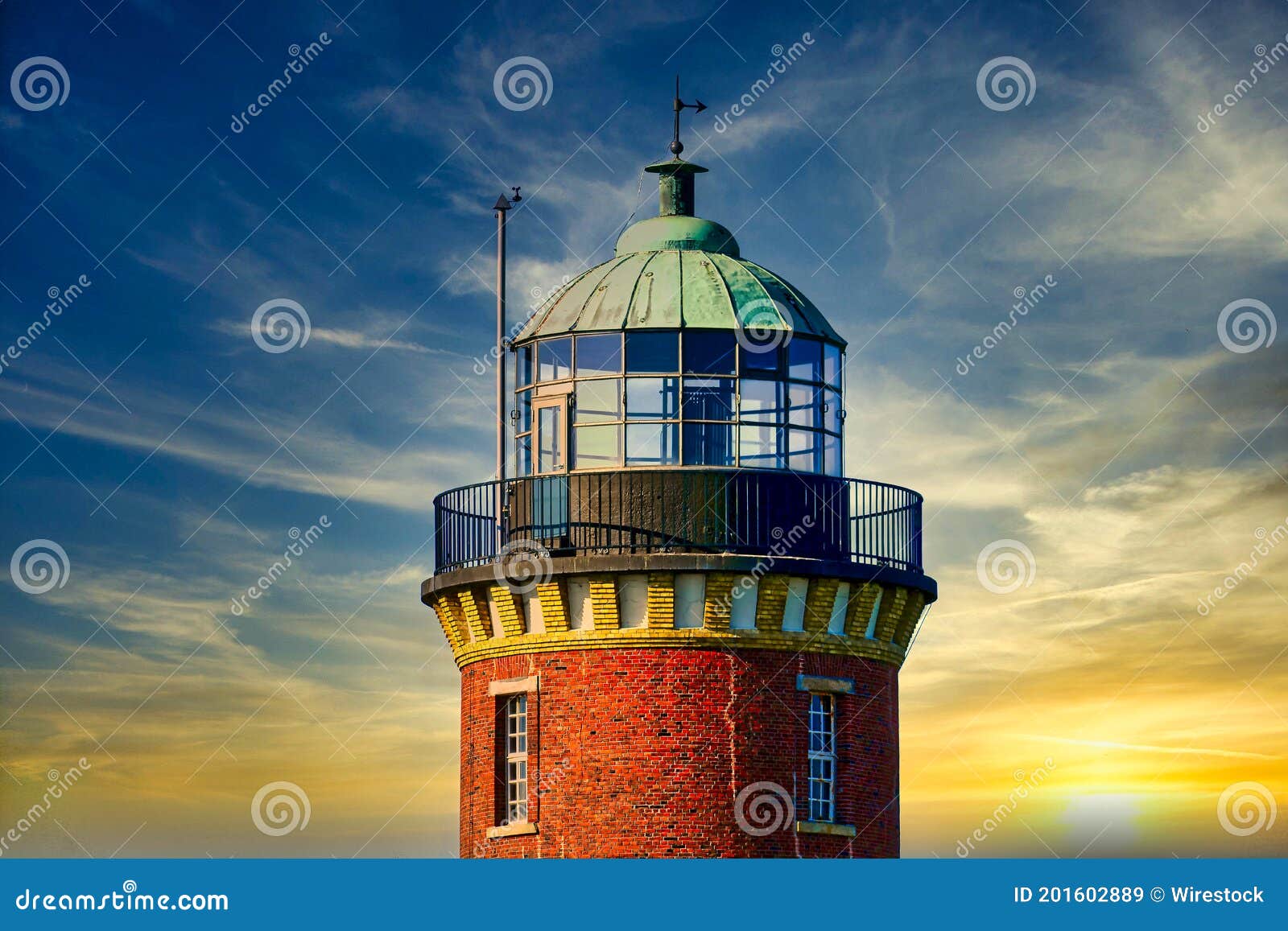 Vertical Shot of a Giant Lighthouse Gleaming Under the Cloudy Sky Stock ...