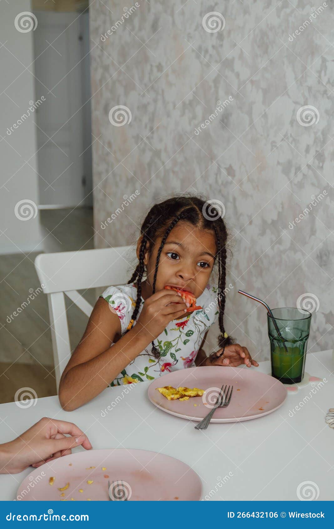 Vertical Shot of a Girl Eating in the Kitchen Stock Photo - Image of ...
