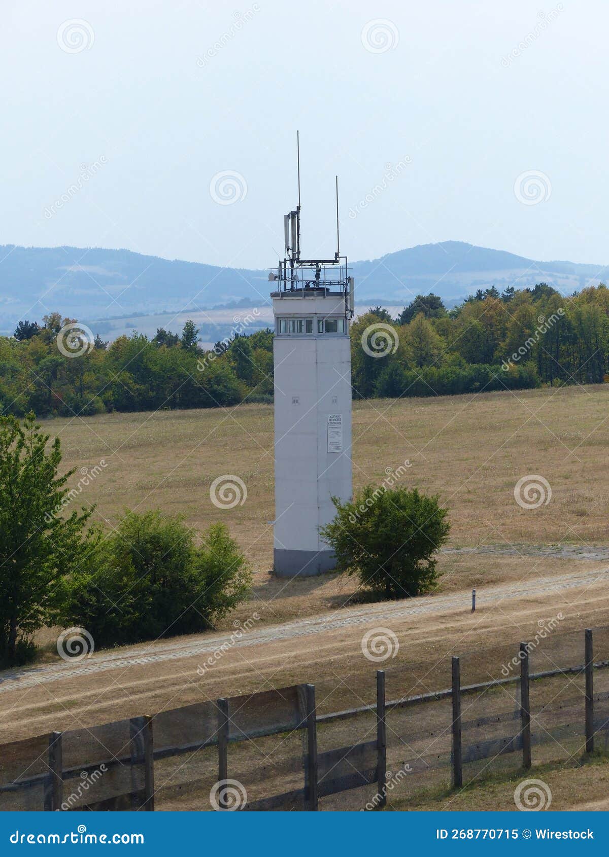 Vertical Shot of a Guard Tower on German Border with Mountains and ...