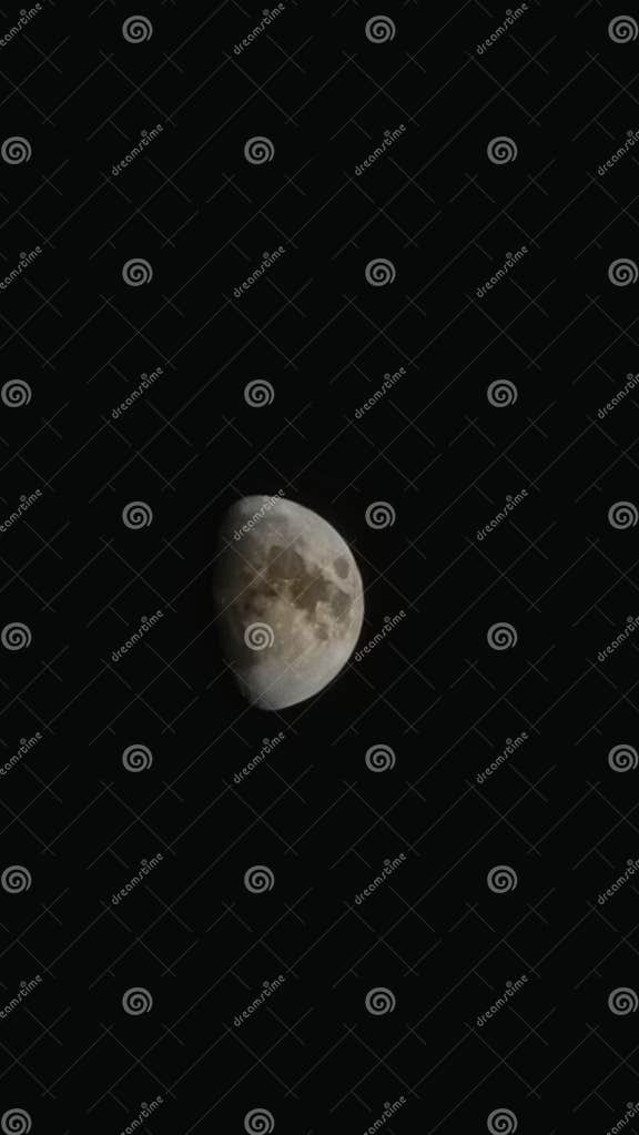 Vertical Shot of the Half Moon in the Night Sky Stock Photo - Image of ...