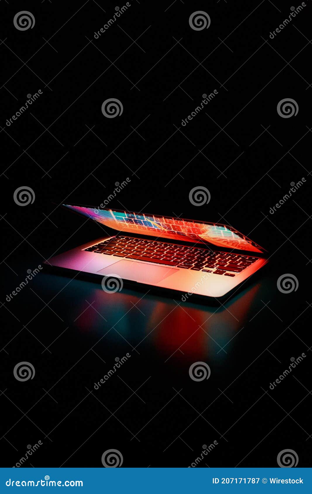 Vertical Shot of a Half-open Laptop Isolated on Dark Background ...