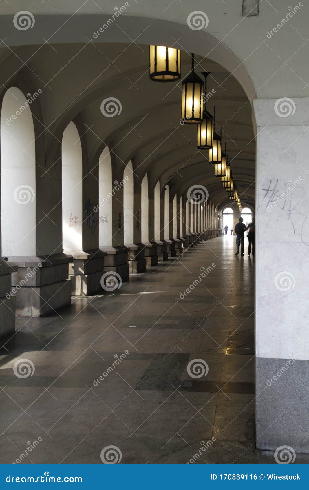 Vertical Shot of a Hallway with People Walking Stock Photo - Image of ...