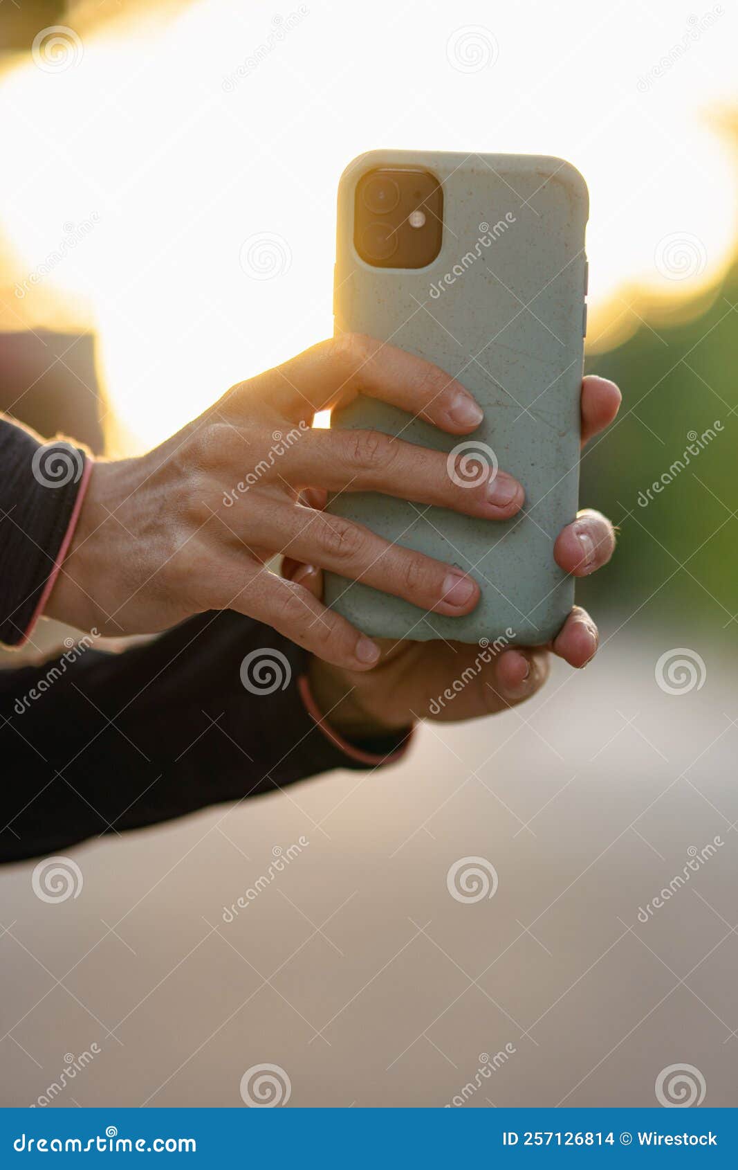 Vertical Shot of Hands Holding a Smartphone and Capturing Stock Photo ...