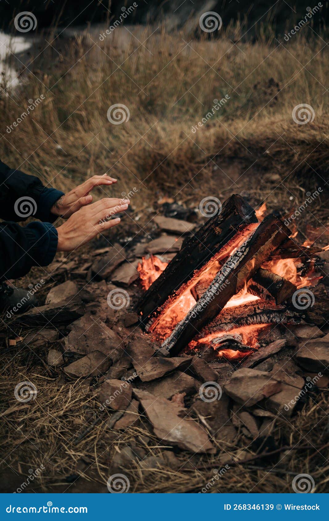Vertical Shot of the Hands of a Man Warming Himself by the Fire Stock ...