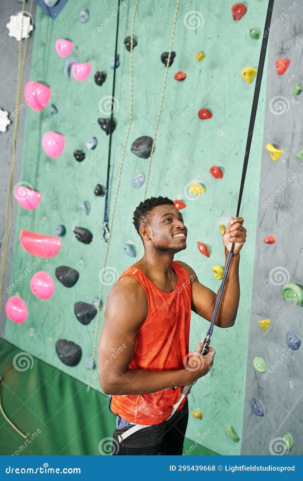 Handsome Smiley Man Over Dark Background Stock Photo | CartoonDealer ...