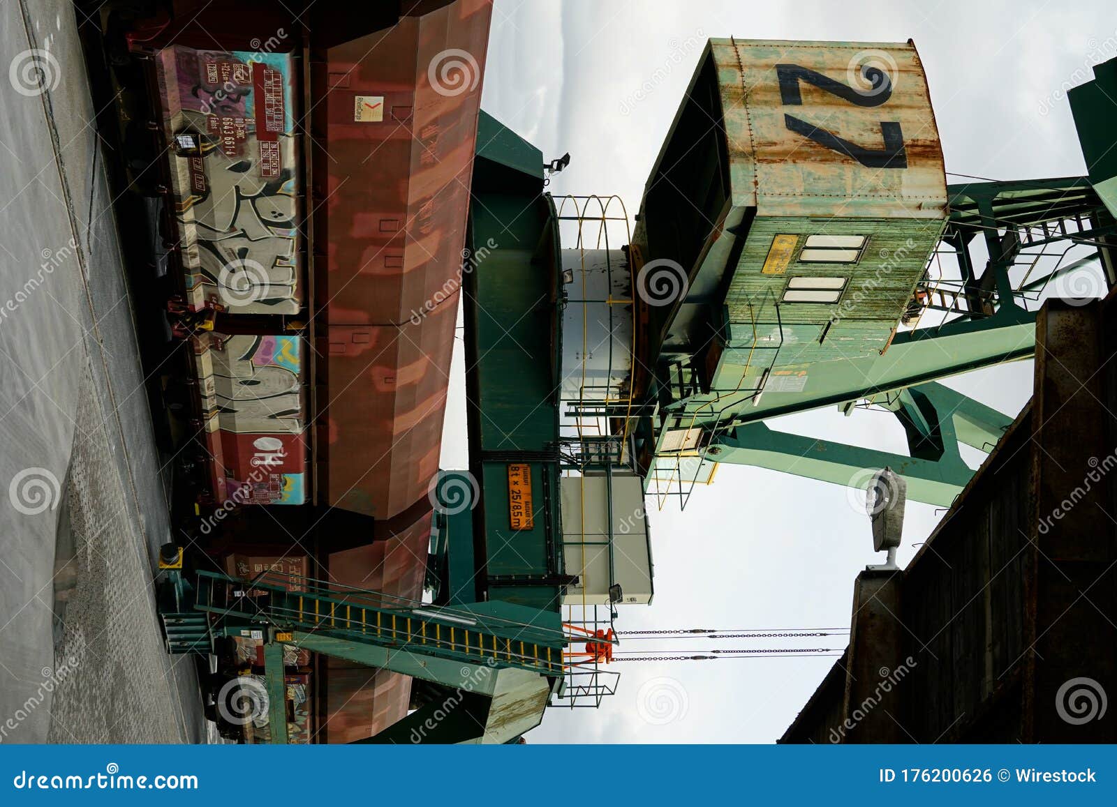 Vertical Shot of Heavy Machinery Loading a Rail Freight Train ...