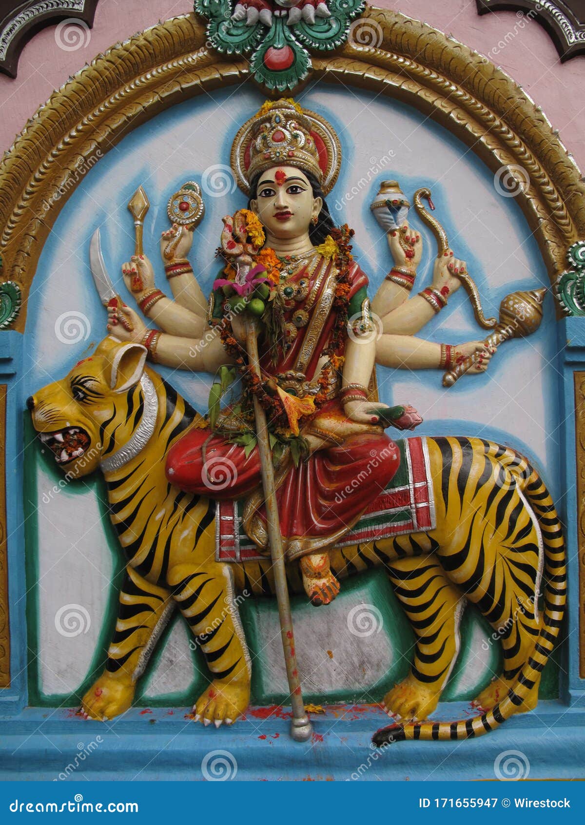 Vertical Shot of a Hindu God Sculpting on the Wall Stock Image - Image ...