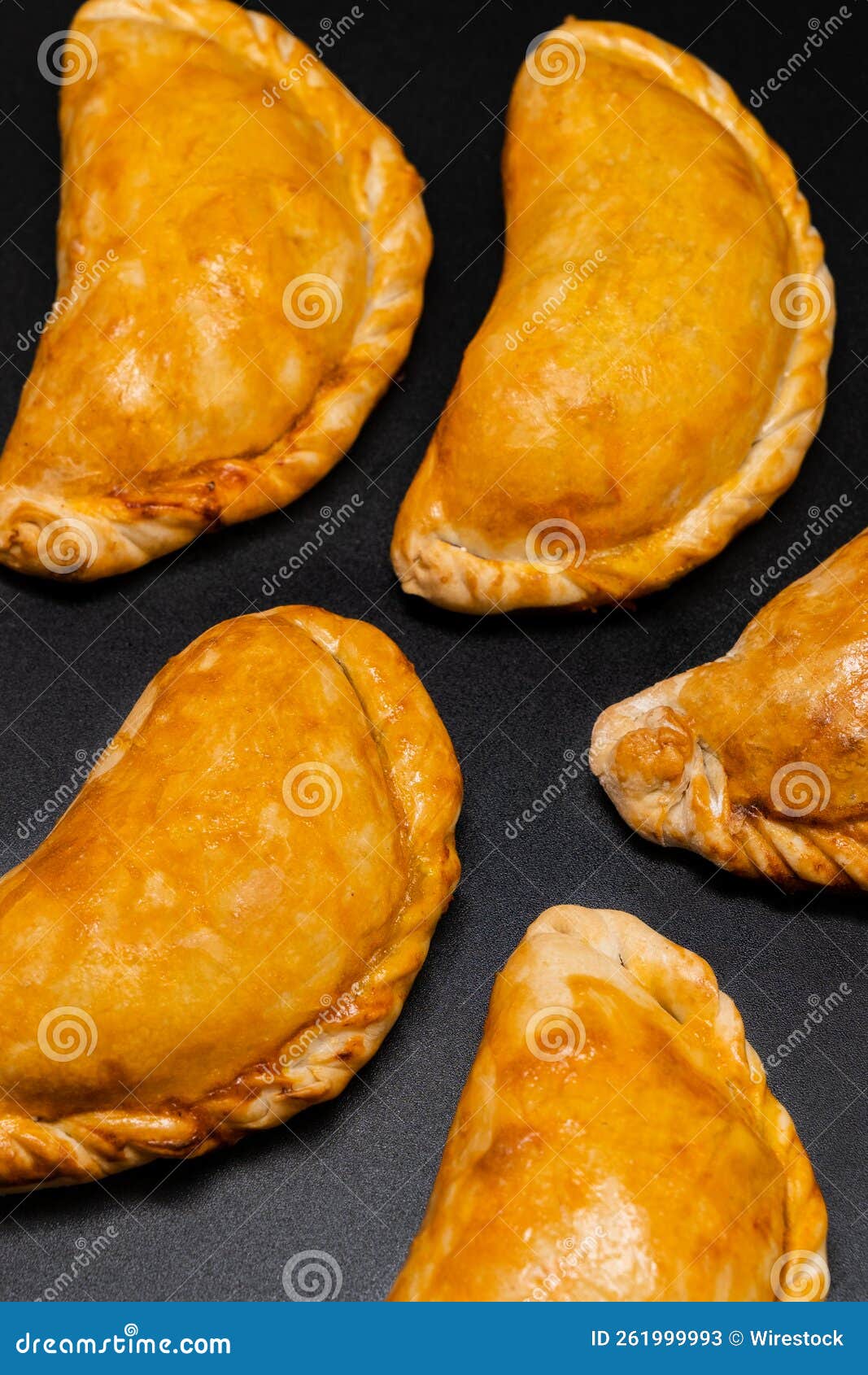 Vertical Shot of Homemade Empanadas on a Black Background Stock Image ...