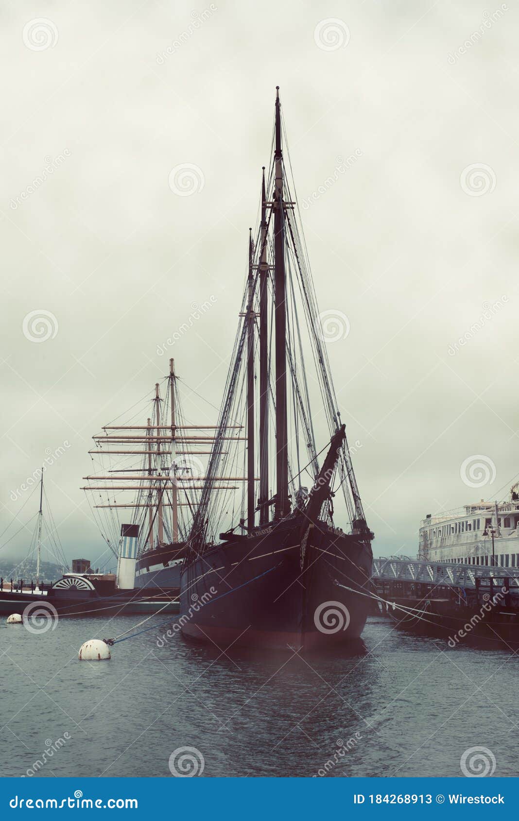 Vertical Shot of a Huge Old Ship in a Dock Captured on a Cloudy Day ...