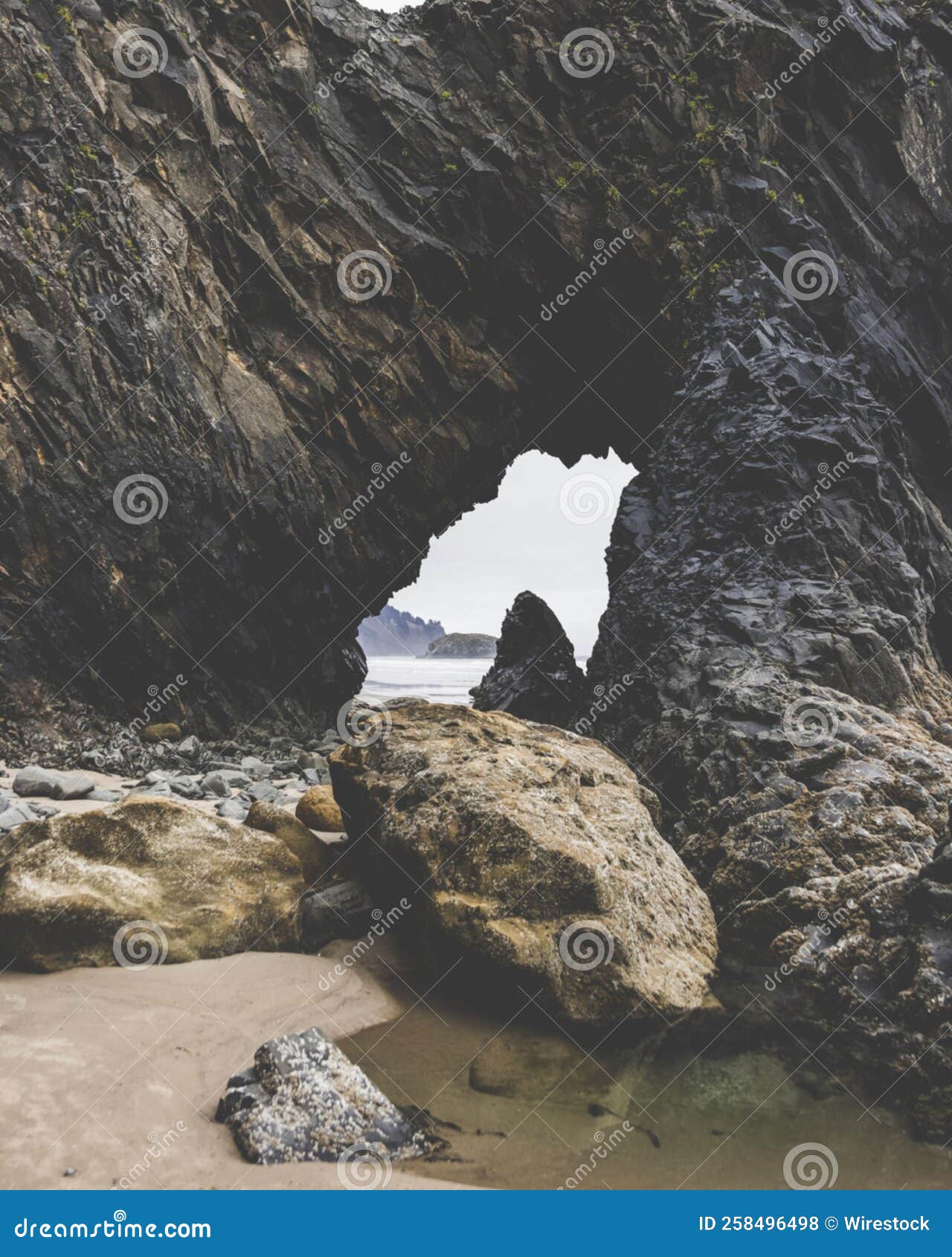 Vertical Shot of a Huge Rock with a Hole Stock Photo - Image of scenic ...