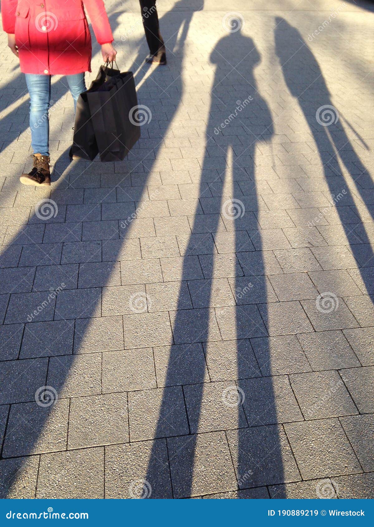 Vertical Shot of Human Shadows on the Ground Stock Image - Image of ...