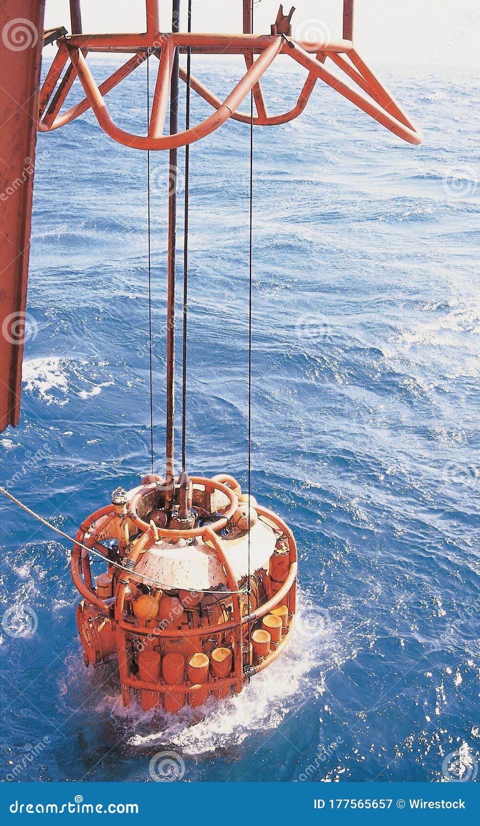 Vertical Shot of a Hyperbaric Deep Dive Chamber in the Sea Hanging Next ...