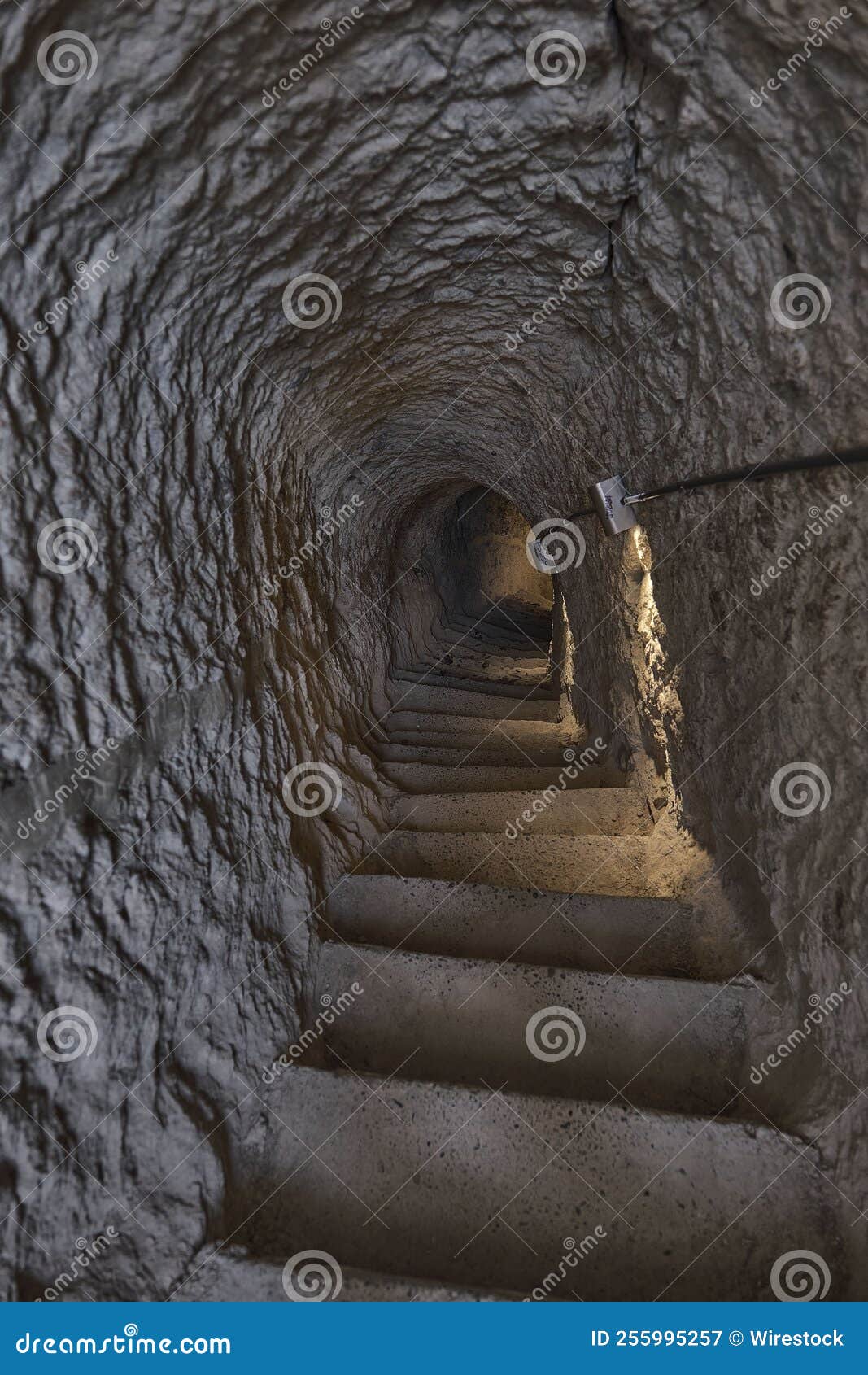 Vertical Shot of the Inside of a Cave with Stairs Stock Image - Image ...