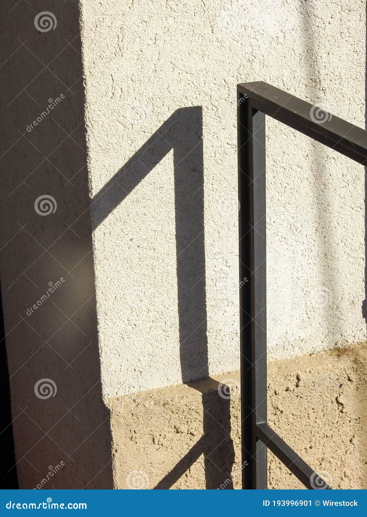 Vertical Shot of an Iron Railing with Its Shadow on the Wall Stock ...
