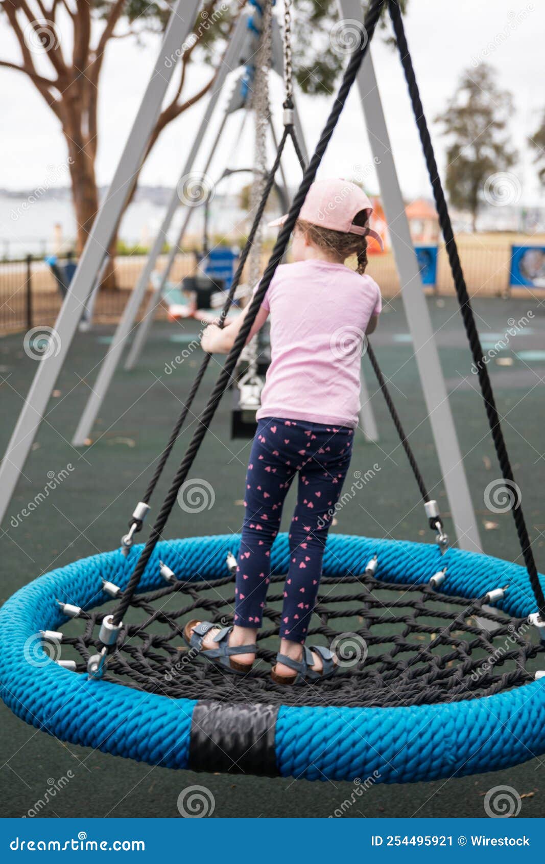 Vertical Shot of a Kid Playing on the Playground Stock Image - Image of ...