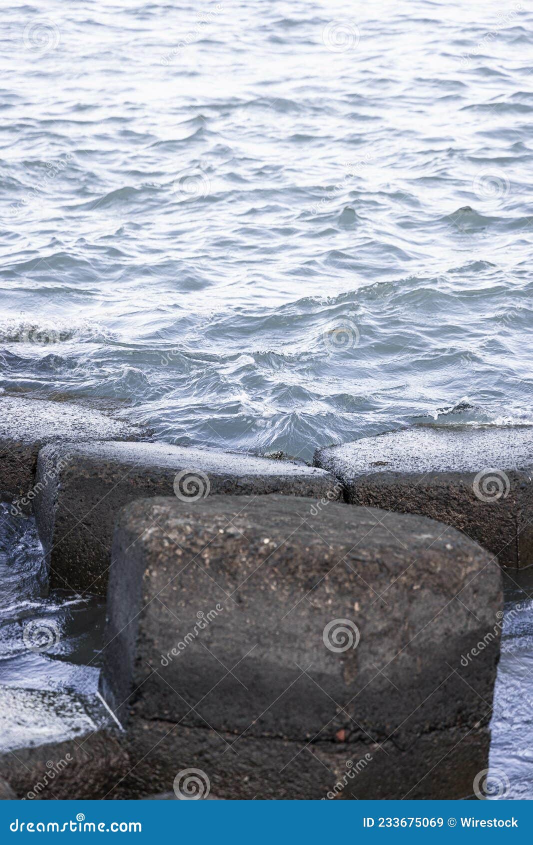 Vertical Shot of Large Gray Rocks on a Sea Shore Stock Image - Image of ...