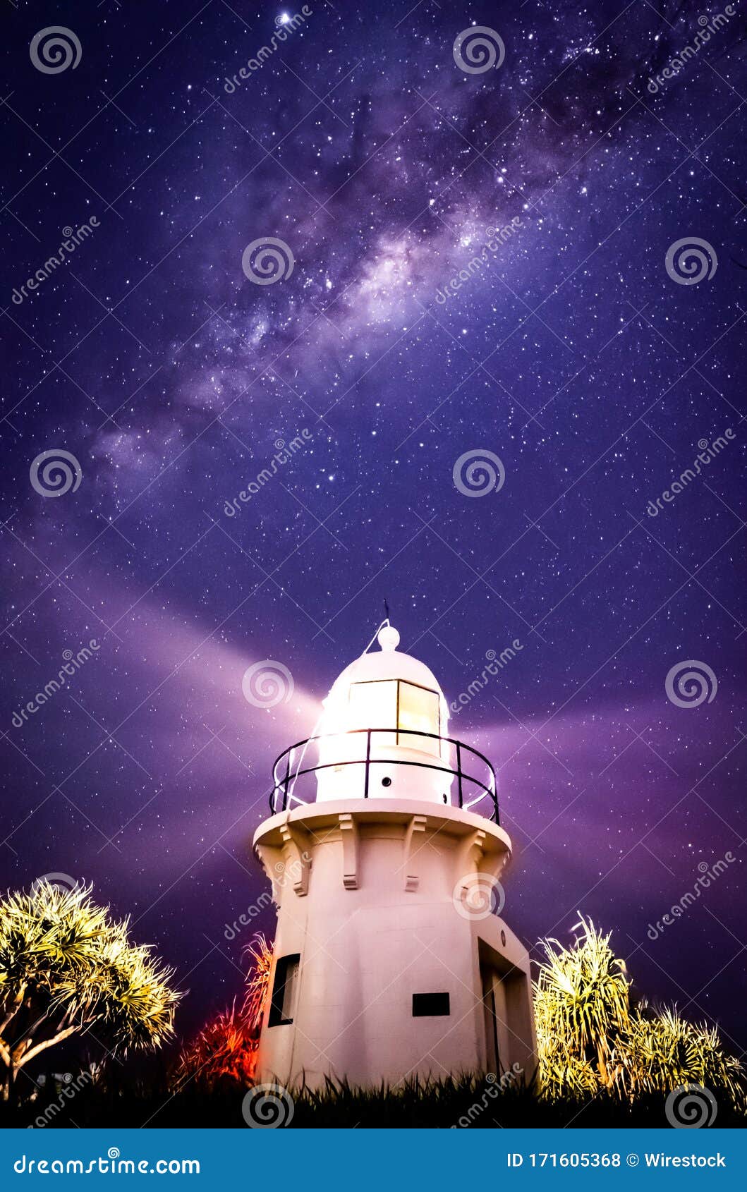 Vertical Shot of a Lighthouse Under the Beautiful Milky Way Galaxy ...
