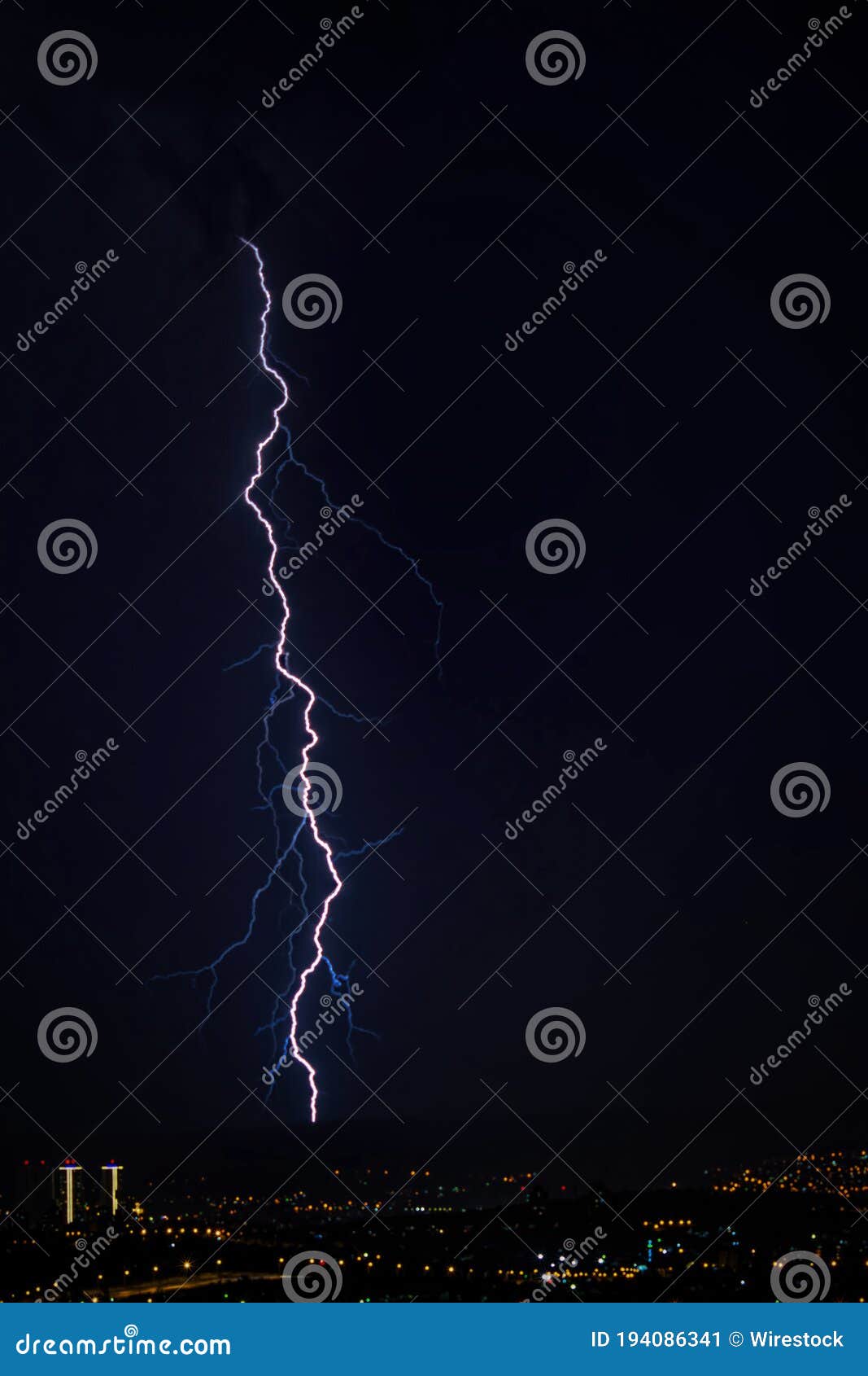Vertical Shot of Lightning Above a City at Night - Great for Wallpapers ...