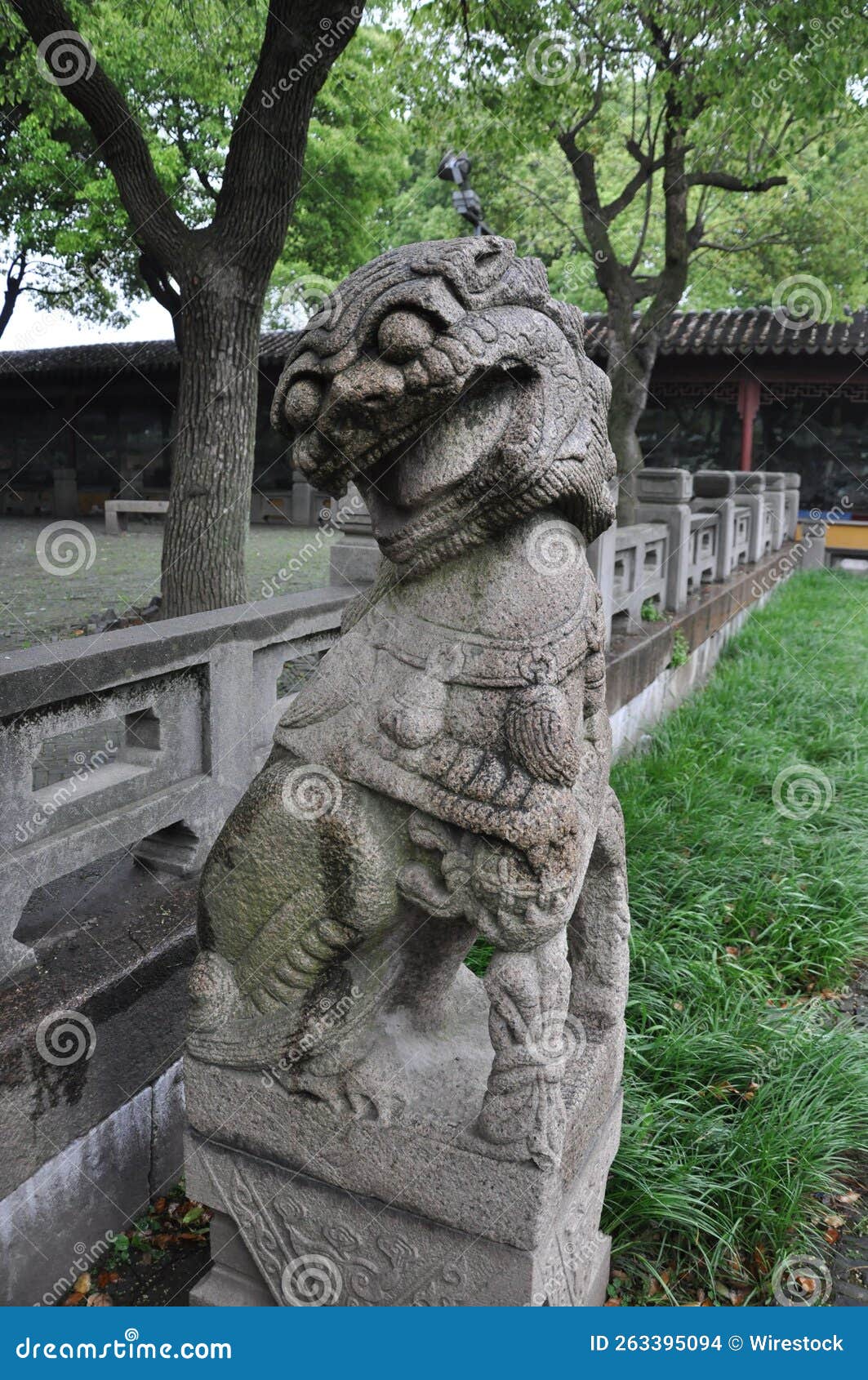 Vertical Shot of a Lion Statue with a Silly Weird Face in a Park Stock ...