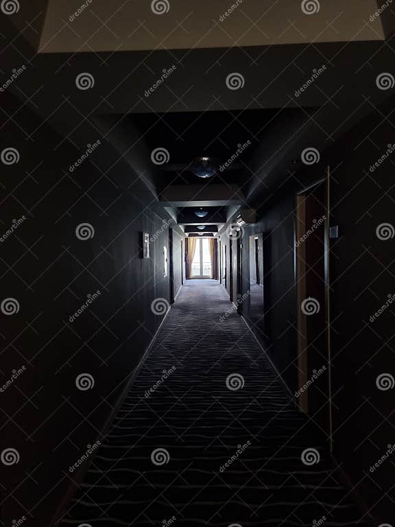 Vertical Shot of a Long Dark Hallway Stock Image - Image of wall ...