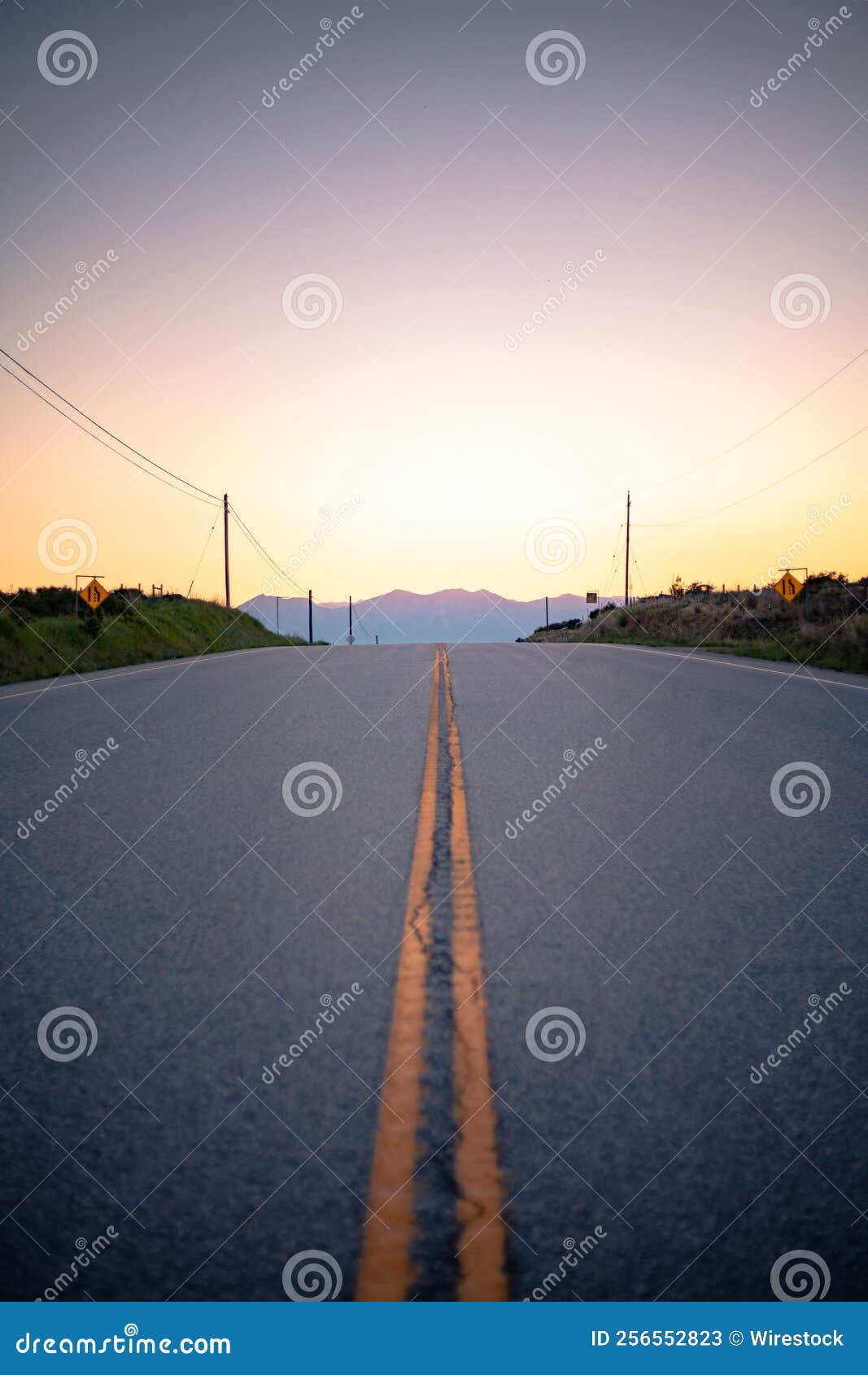 Vertical Shot of a Long Road at Sunset Stock Image - Image of vertical ...