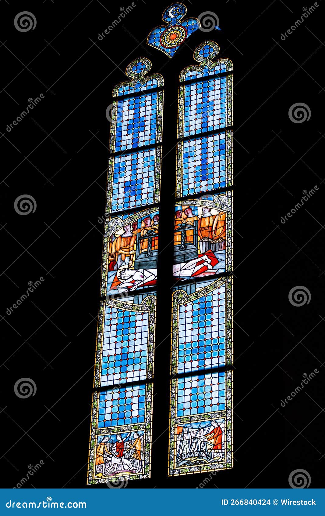 Vertical Shot of a Long Window with Stained Glass Designs in a Building ...