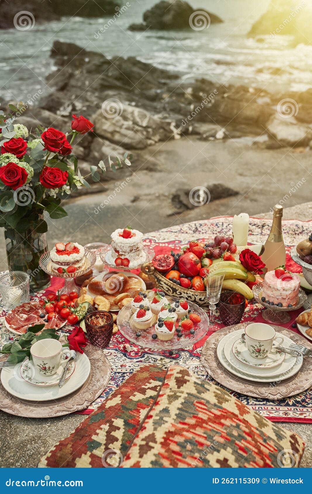 Vertical Shot of a Luxurious Romantic Picnic on a Seashore Stock Image ...