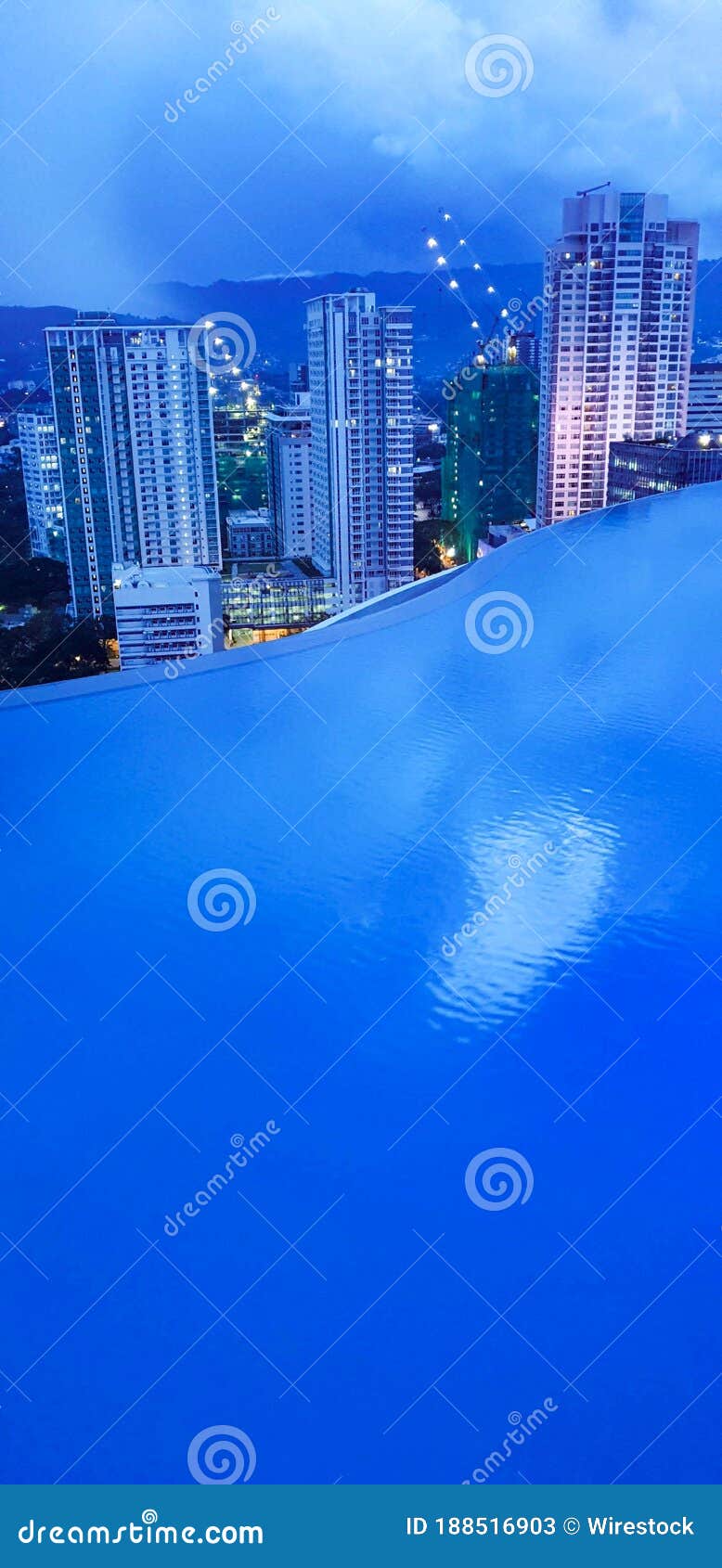 Vertical Shot of Luxury Rooftop with Infinity Pool and Cebu City in the ...